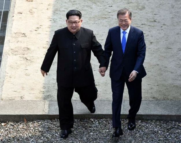 Kim Jong Un Holds Moon Jae-in’s Hand In Historic Meeting