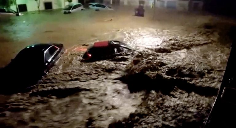British couple killed in their taxi after being hit by flash flood in ...